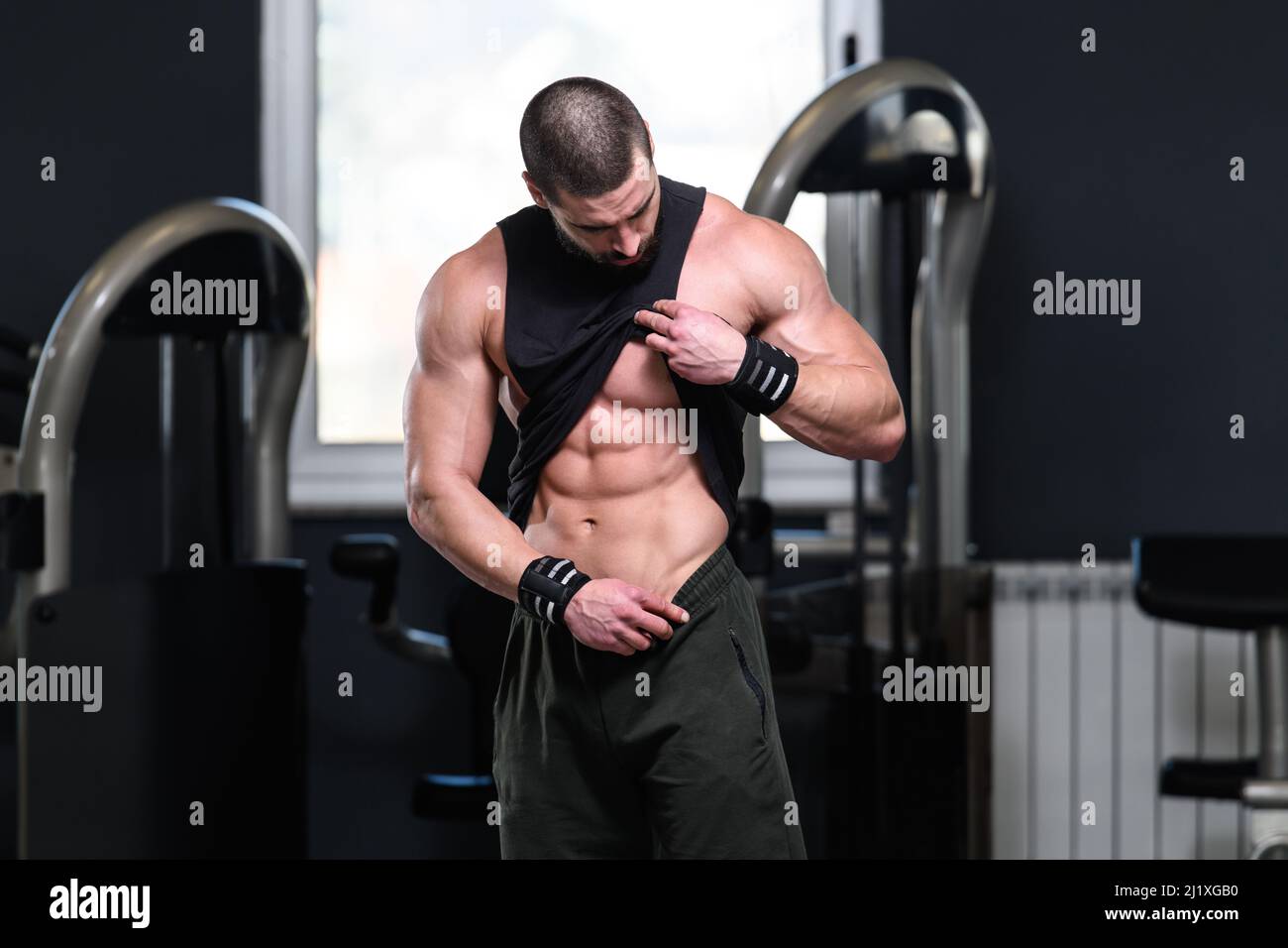 Portrait Of A Young Physically Fit Man Showing His Well Trained Body ...