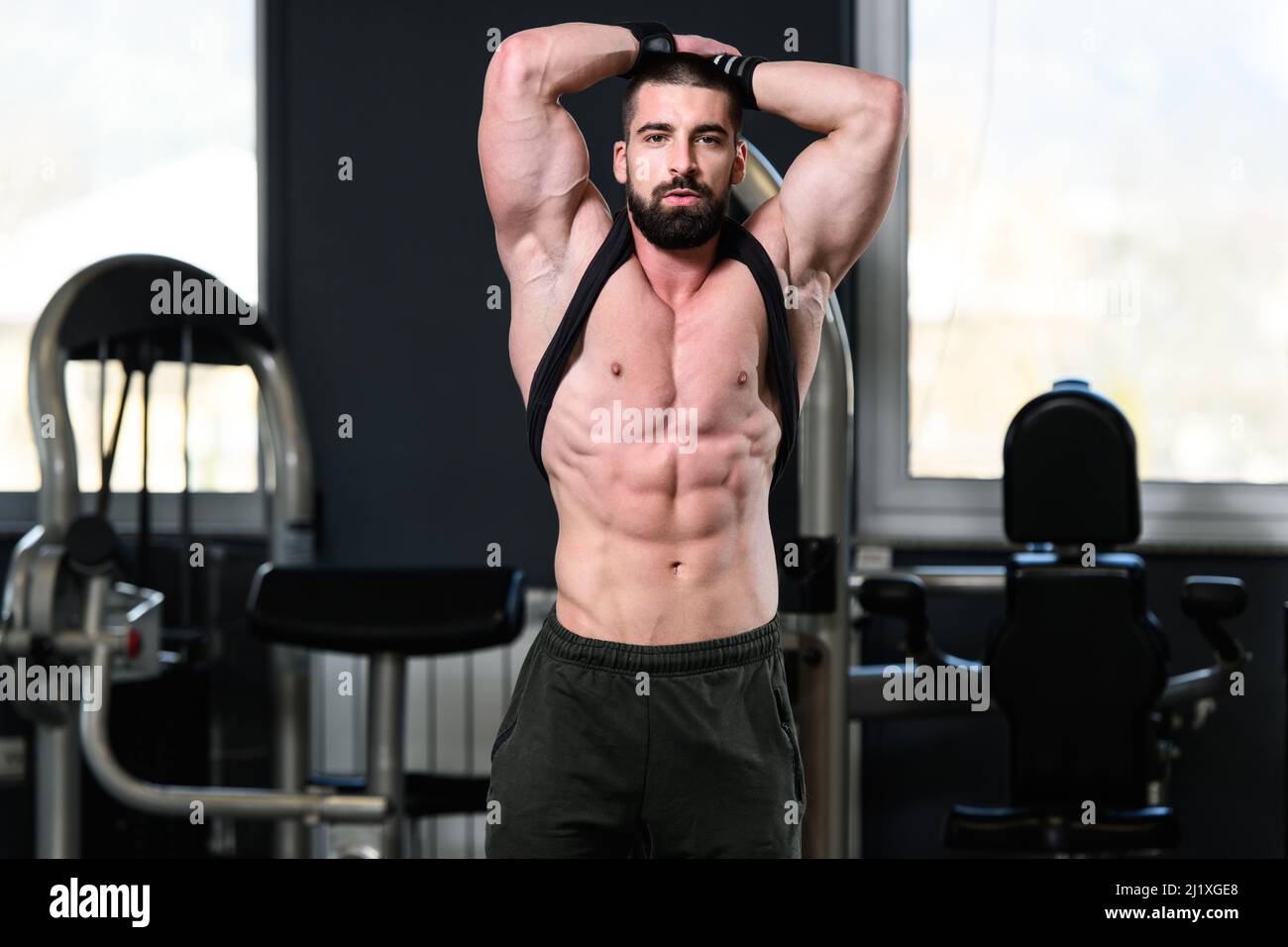 Portrait Of A Young Physically Fit Man Showing His Well Trained Body ...