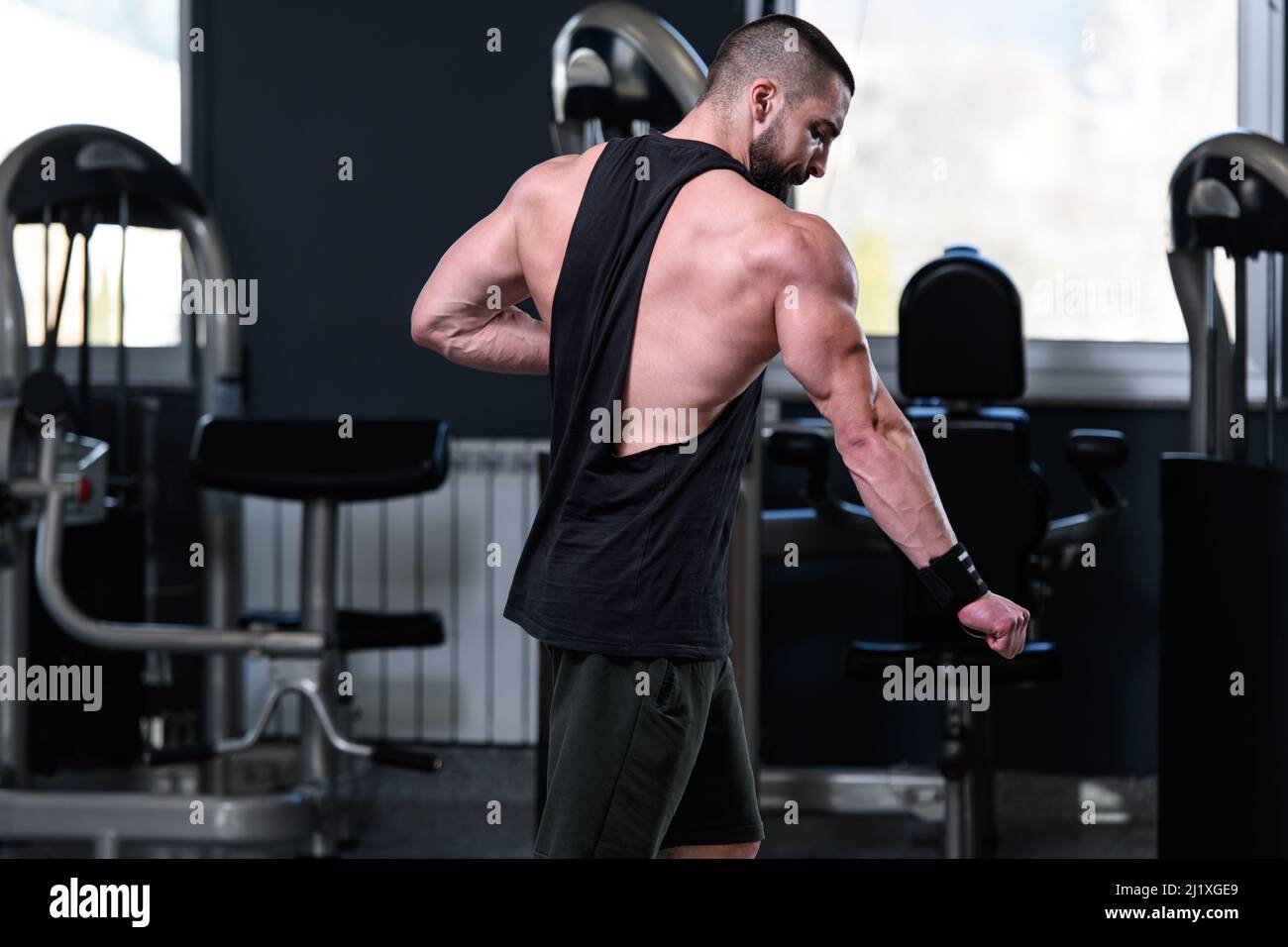Portrait Of A Young Physically Fit Man Showing His Well Trained Body ...
