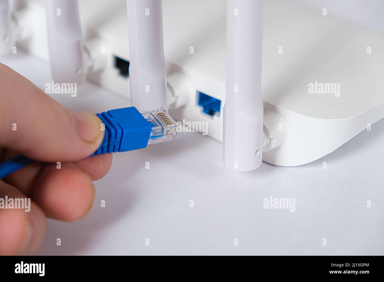 The wizard inserts the Internet cable into the Wi-Fi router. Internet ...