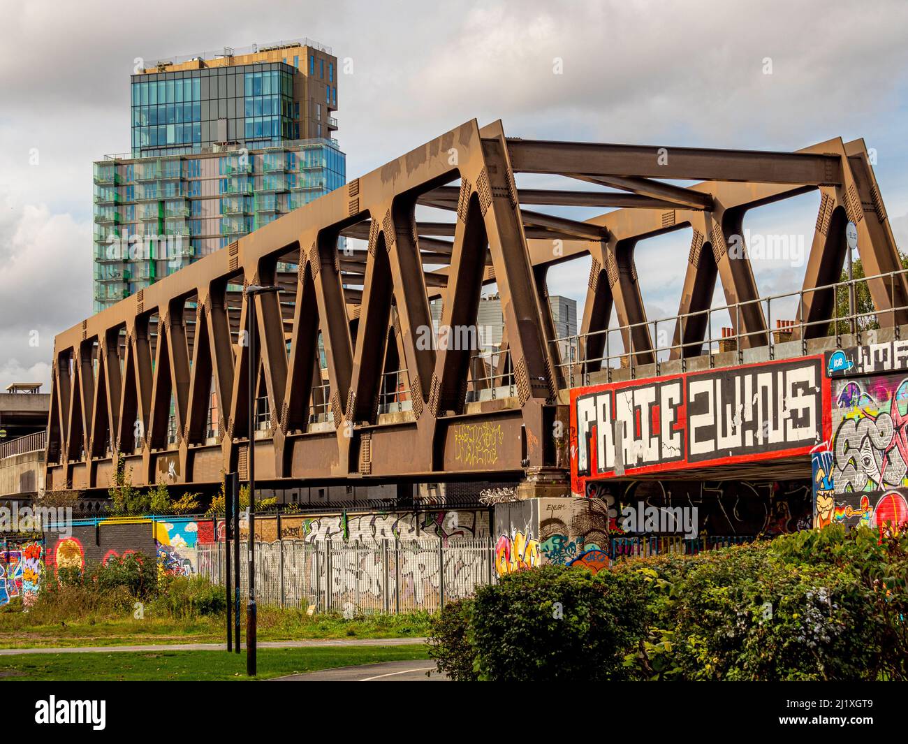 Railway bridge with graffiti seen from Station Park in the Spitalfields ...