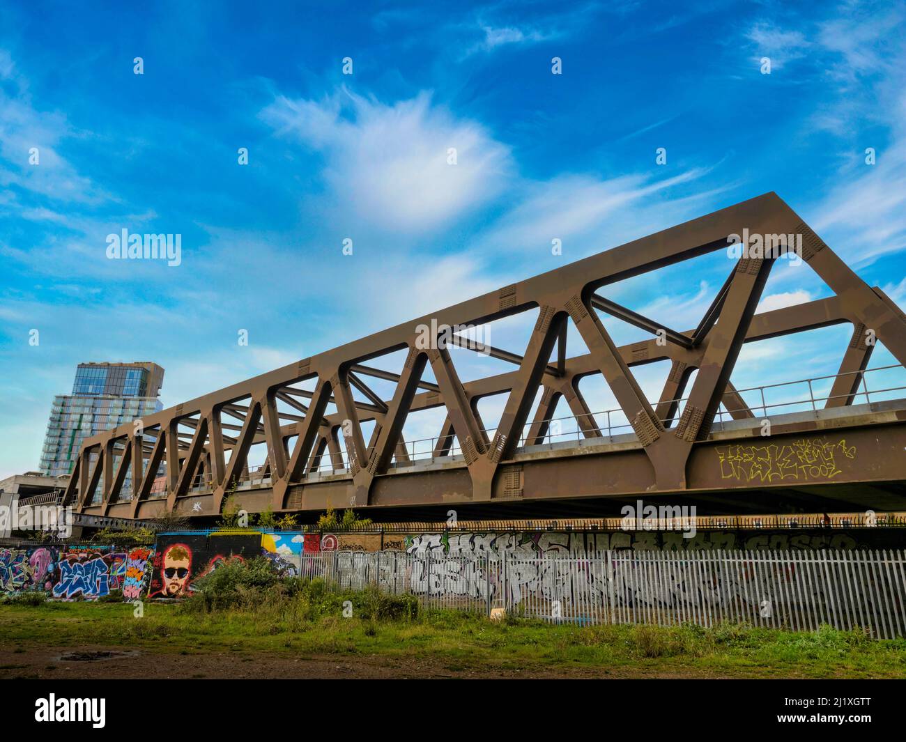 Railway bridge with graffiti seen from Station Park in the Spitalfields ...