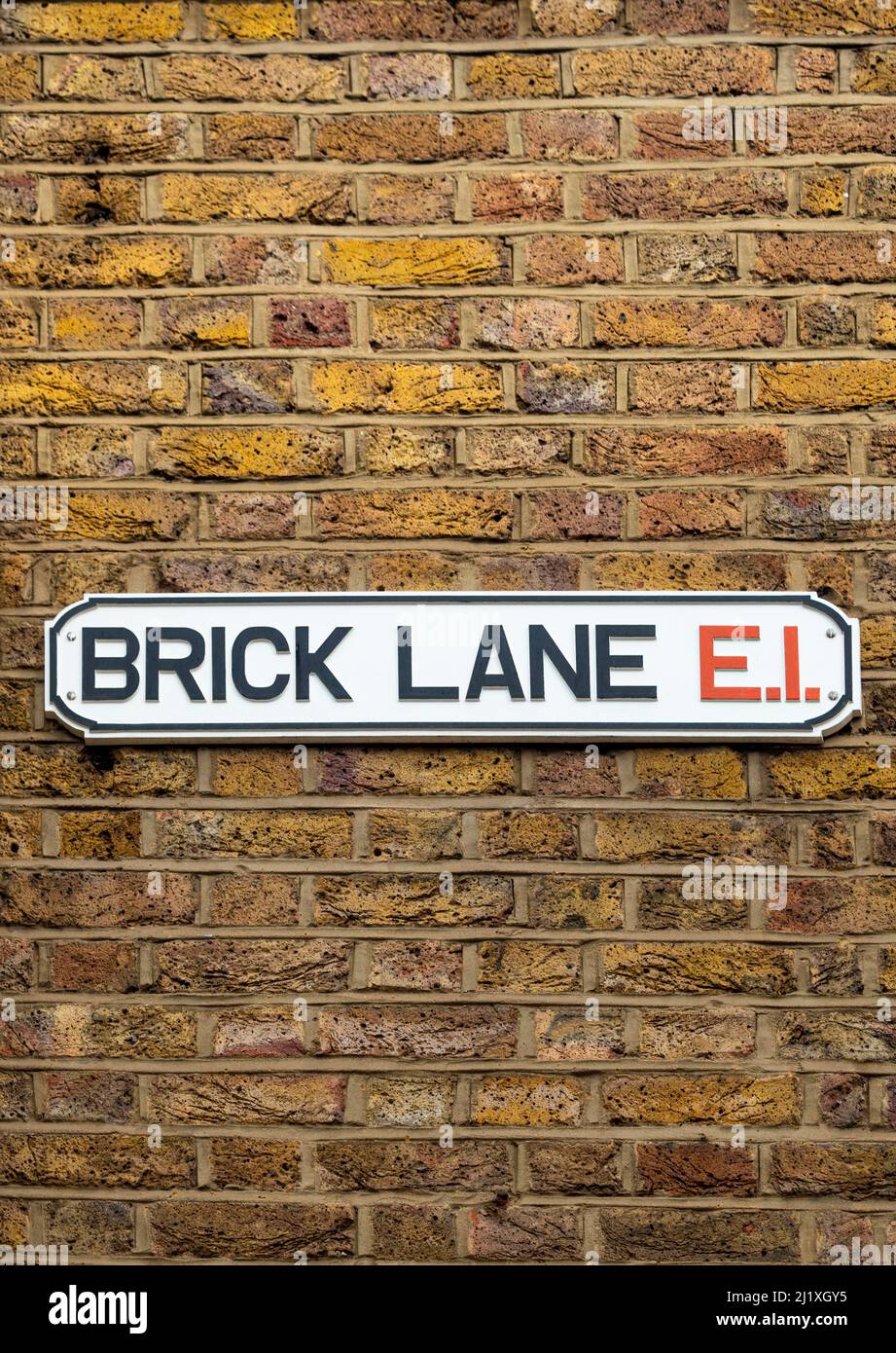 Road sign for Brick Lane mounted on a building exterior wall. London ...