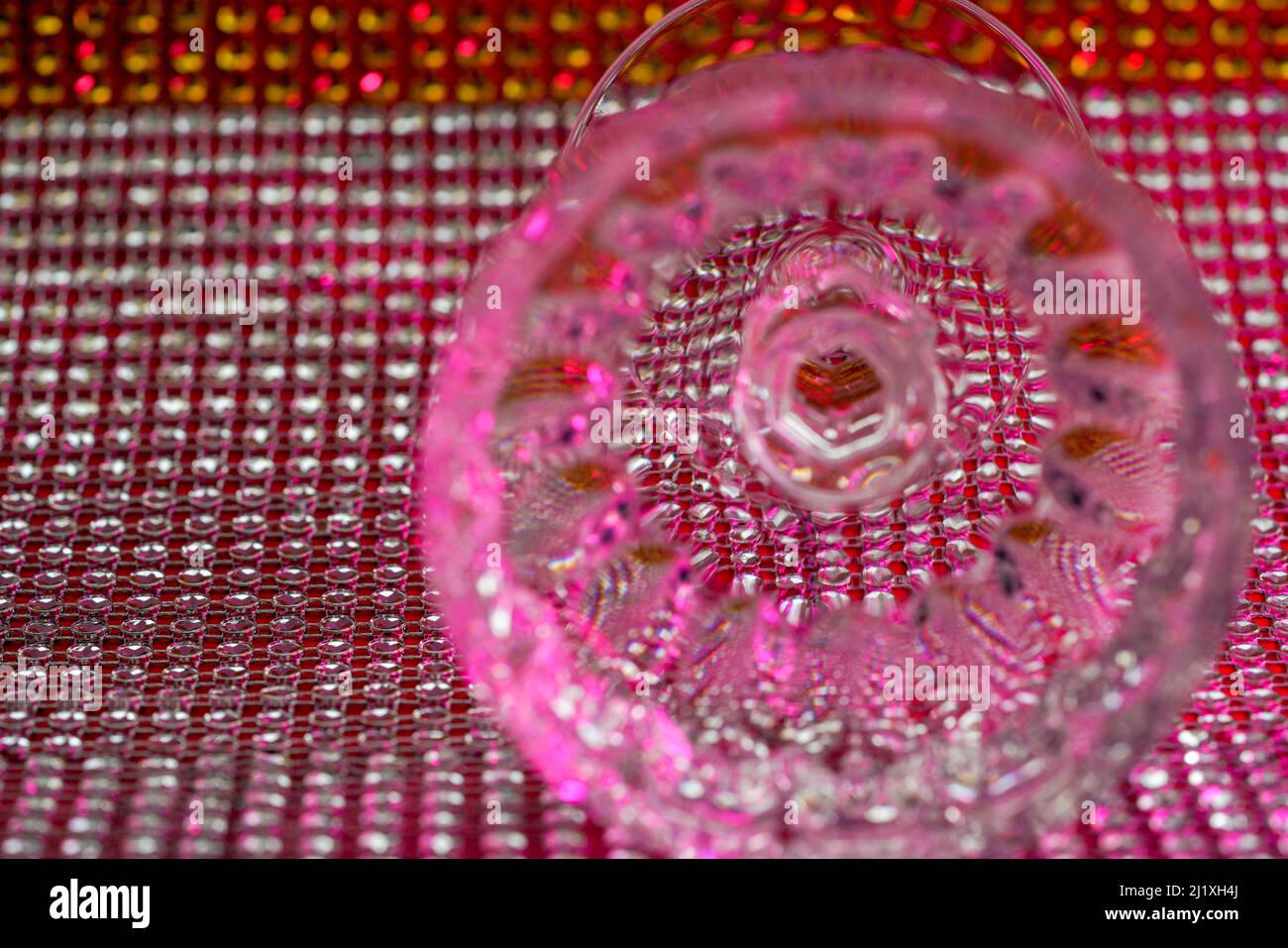 Glass lit from below with colored light creates consuming patterns to ...
