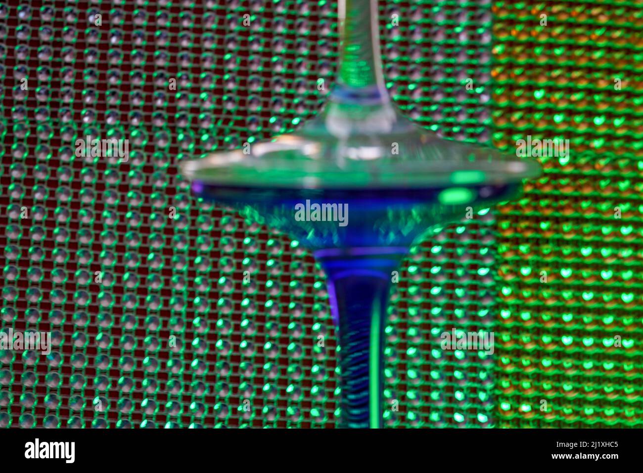 Glass lit from below with colored light creates consuming patterns to ...