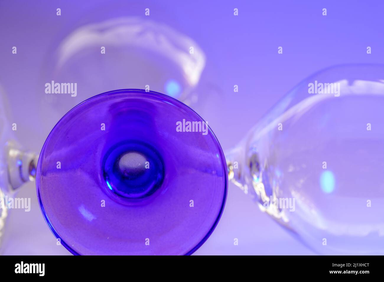 Glass lit from below with colored light creates consuming patterns to ...