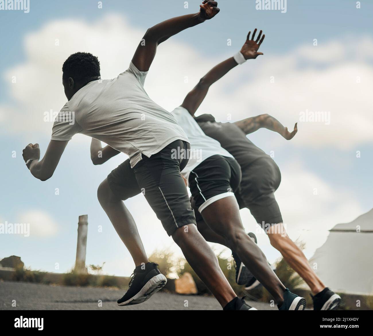 Push yourself to the next level. Shot of a group of men exercising in ...