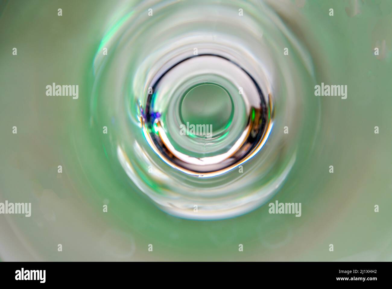 Glass lit from below with colored light creates consuming patterns to ...