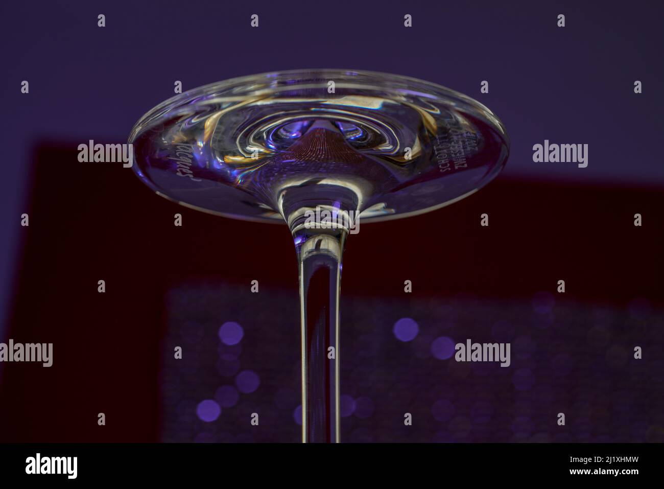 Glass lit from below with colored light creates consuming patterns to ...