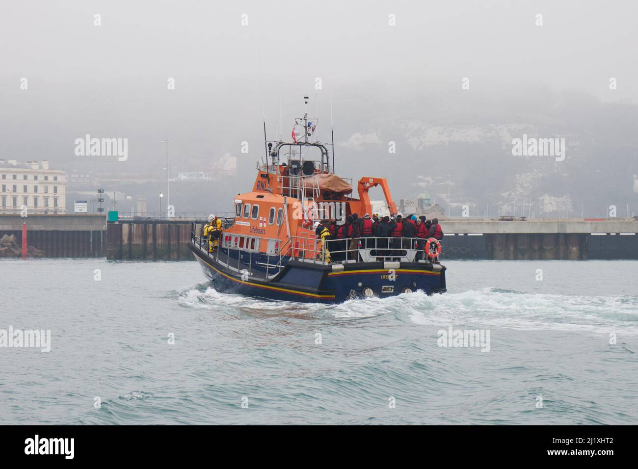 Dover, Kent, UK. 28th March 2022: Migrants are brought ashore at Dover ...