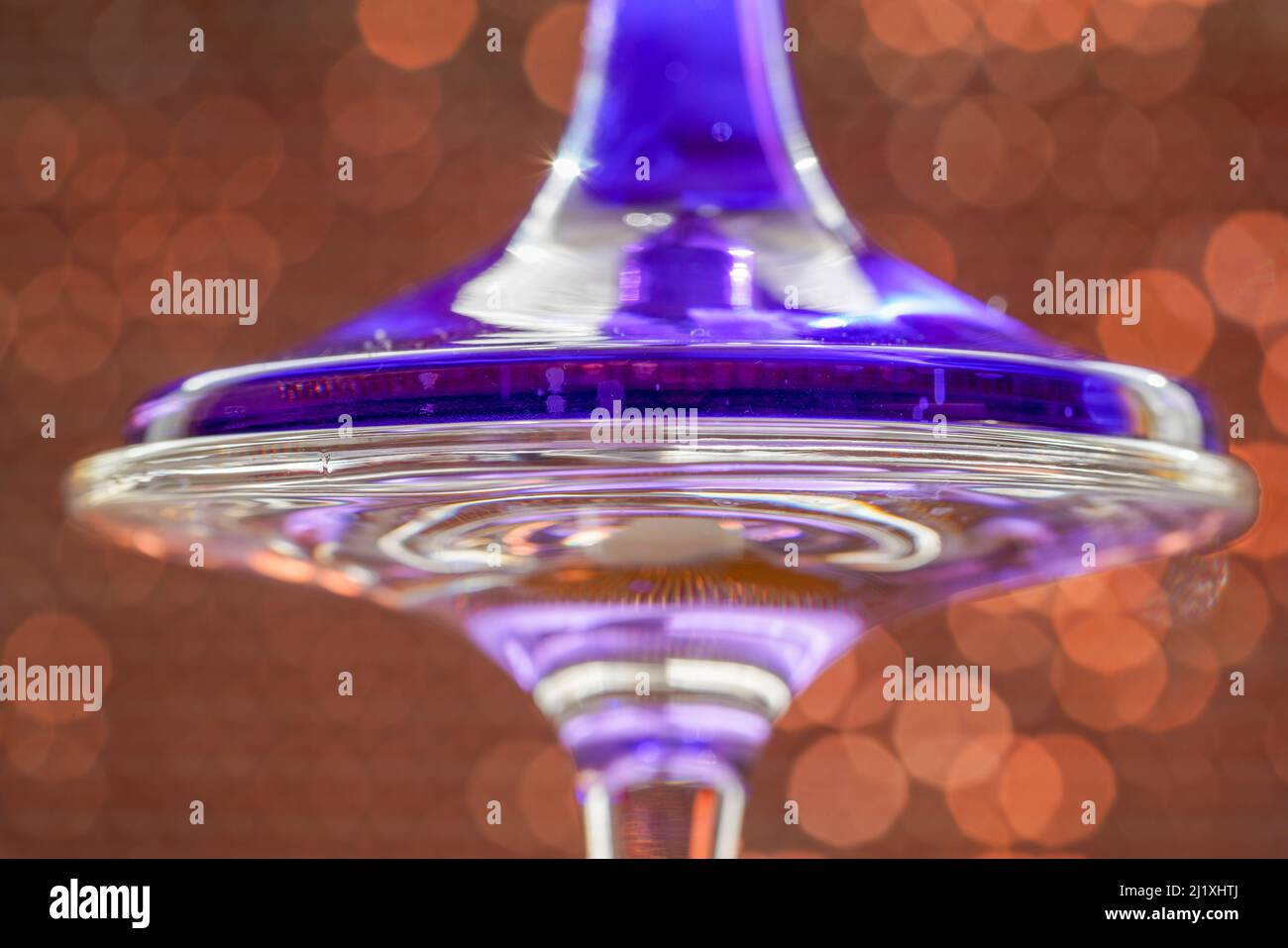 Glass lit from below with colored light creates consuming patterns to ...
