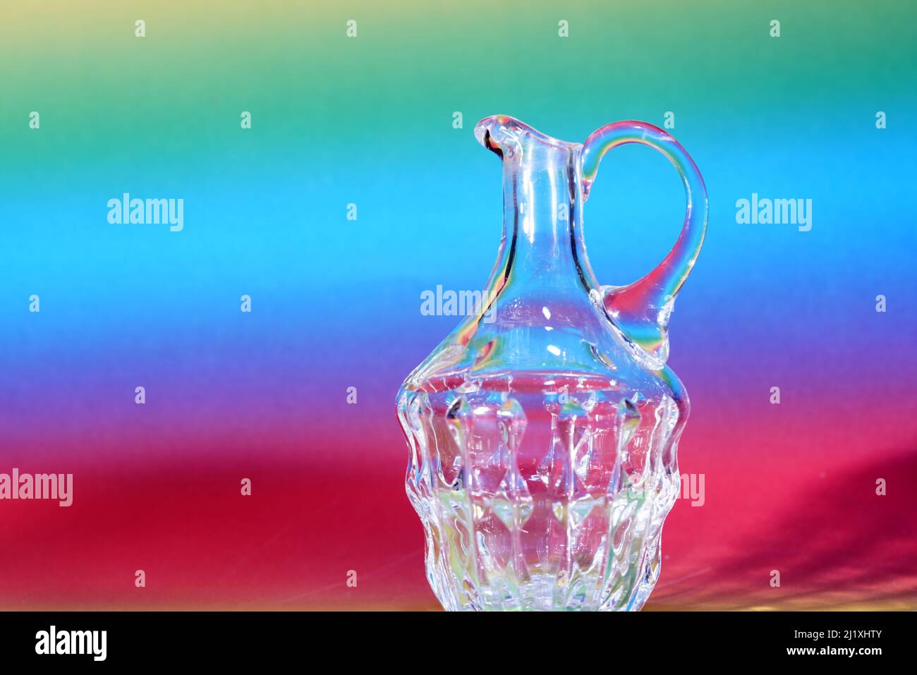 Glass lit from below with colored light creates consuming patterns to ...