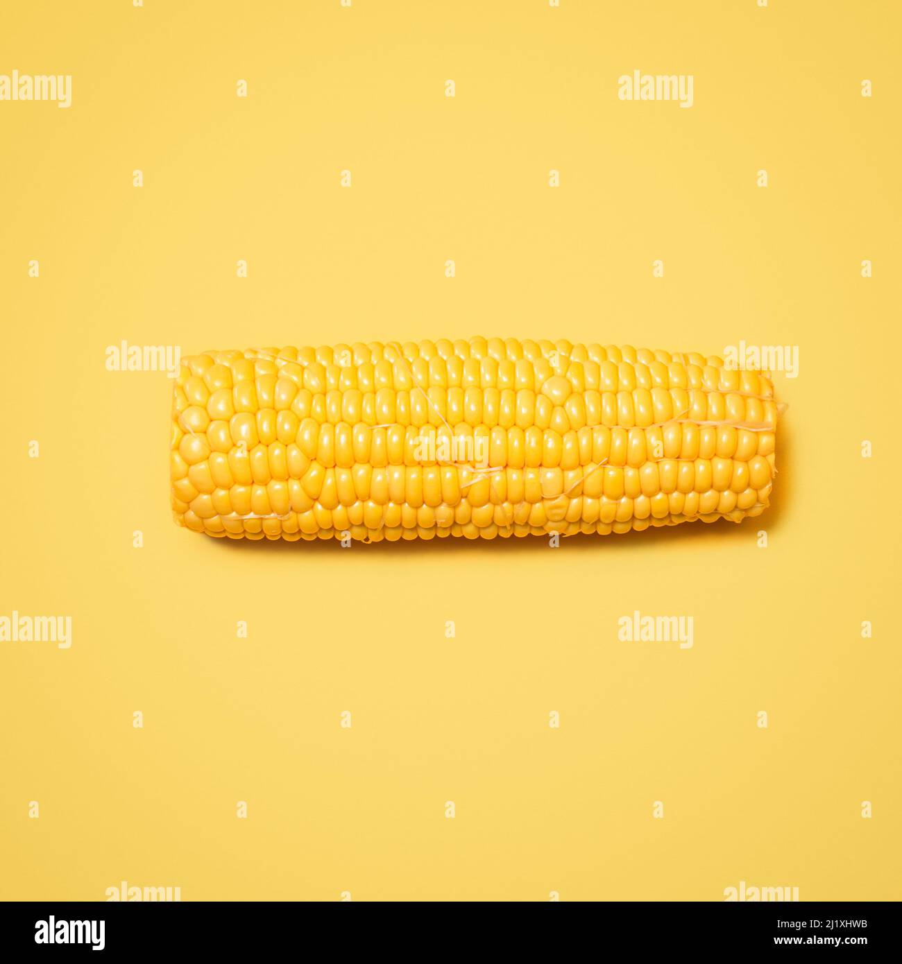 Ready to sink your teeth into this. Shot of a cob of corn against a ...