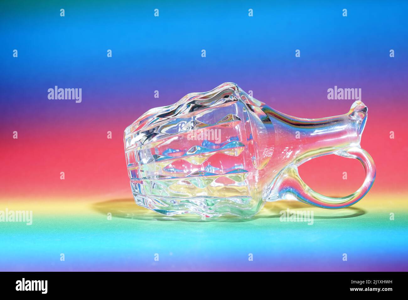 Glass lit from below with colored light creates consuming patterns to ...
