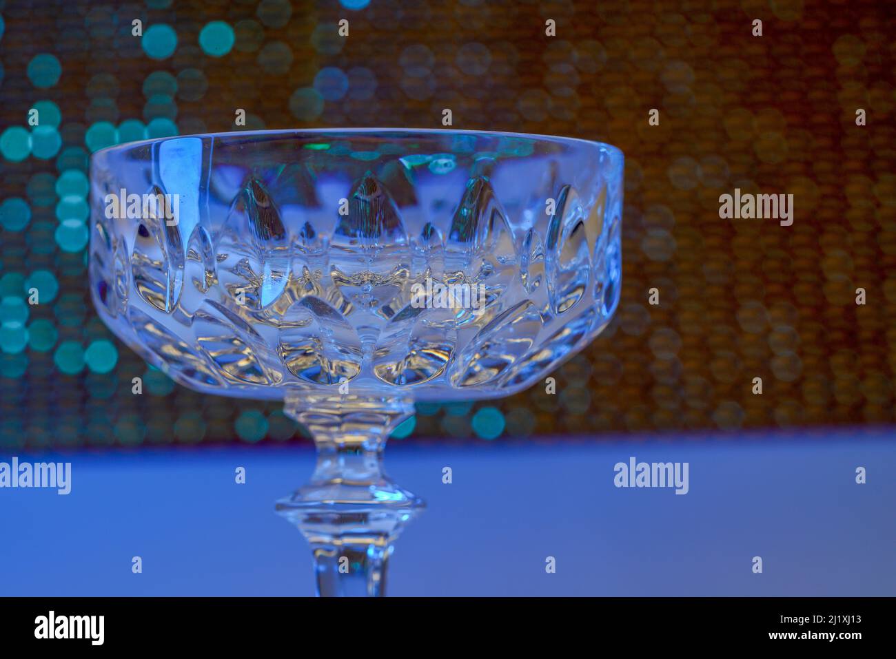 Glass lit from below with colored light creates consuming patterns to ...