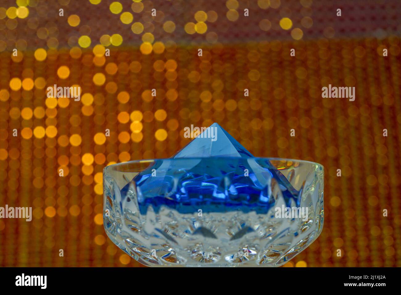Glass lit from below with colored light creates consuming patterns to ...