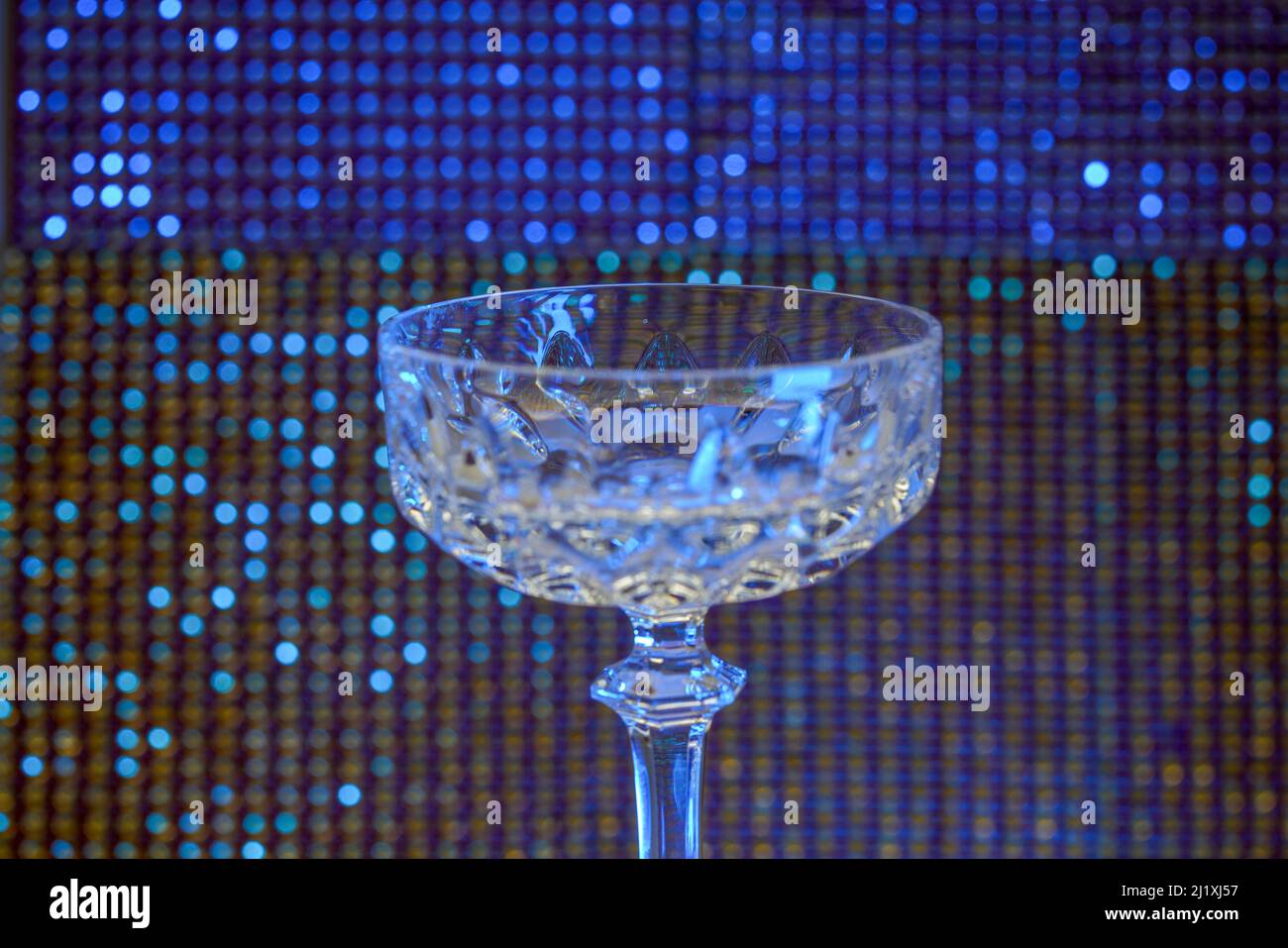 Glass lit from below with colored light creates consuming patterns to ...