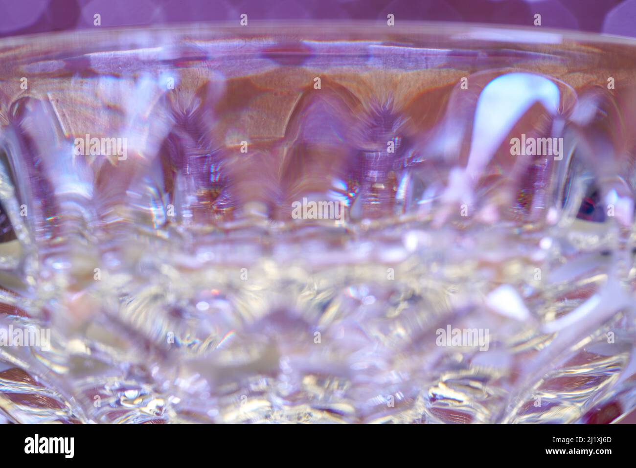 Glass lit from below with colored light creates consuming patterns to ...
