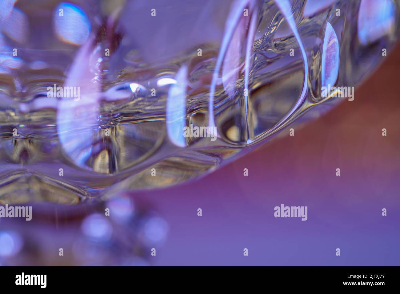 Glass lit from below with colored light creates consuming patterns to ...