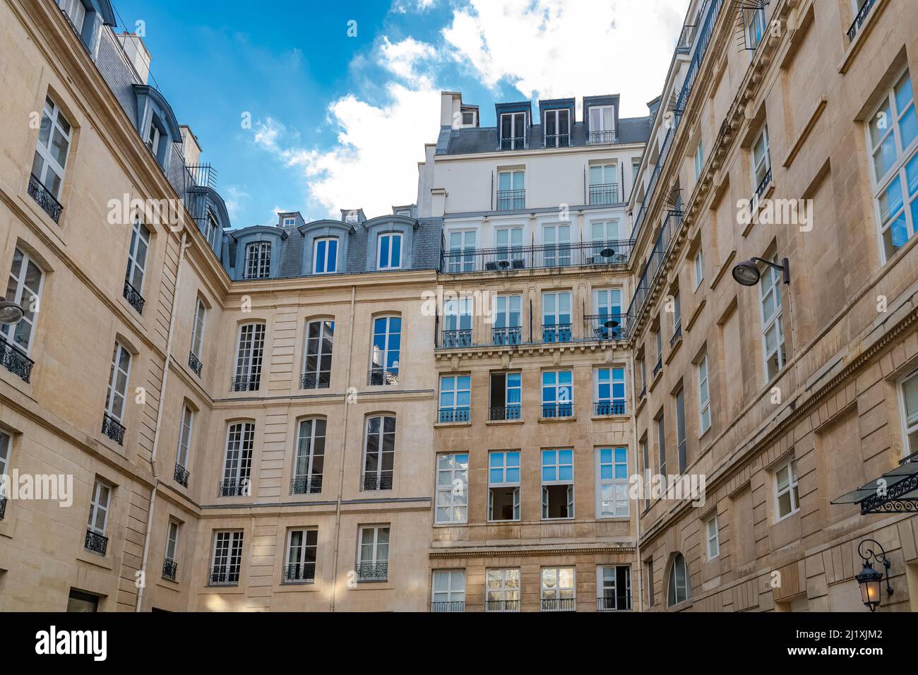Paris, small square with beautiful buildings in the historic center ...