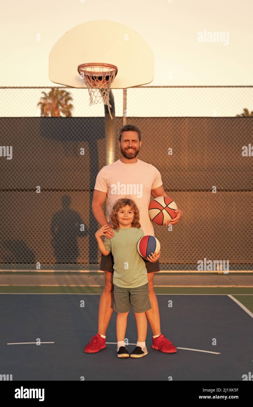 happy fathers day. happy family. dad and kid boy play basketball. child ...
