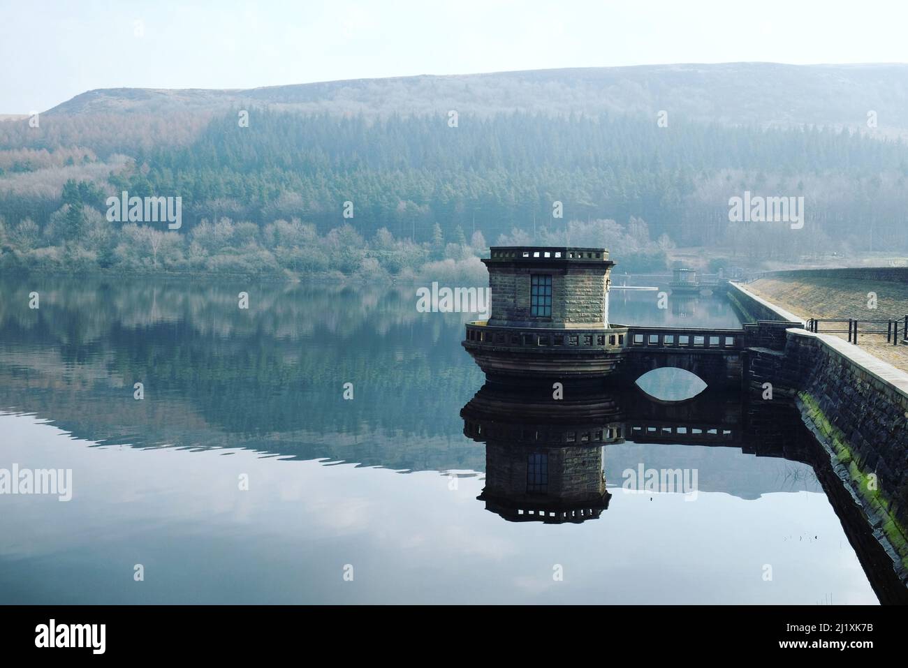 Water outlet tower on the Ladybower Reservoir dam, in the Dark Peak of ...