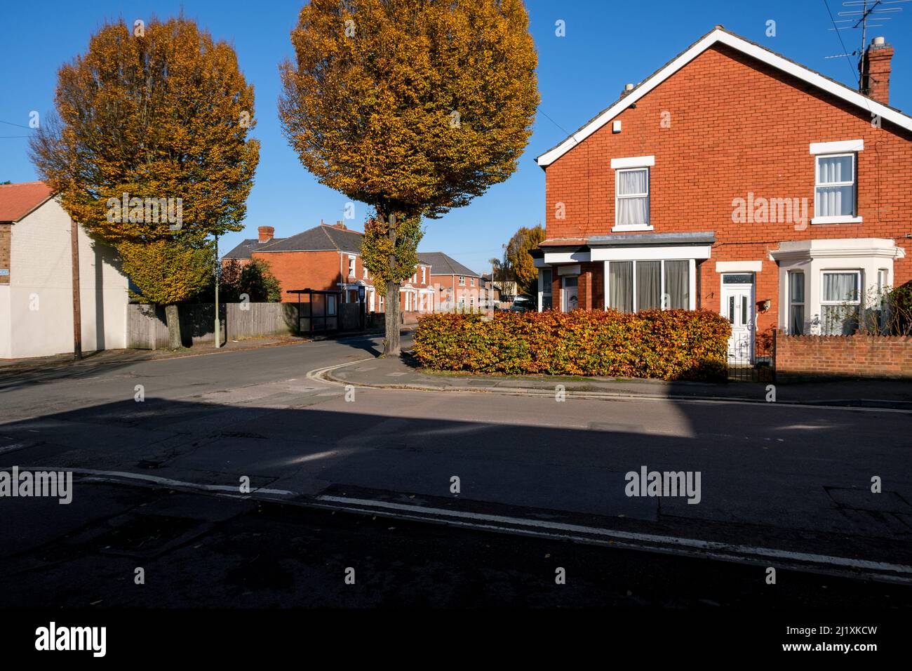 Housing estate made of red brick houses with neat front gardens Stock ...