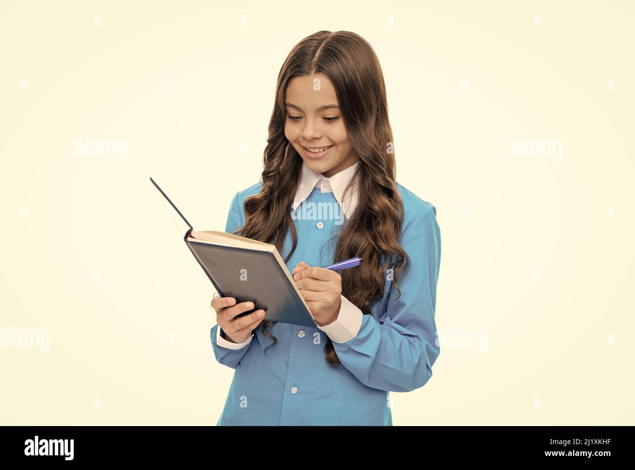 Happy school kid do written homework assignment writing in exercise ... Happy school kid do written homework assignment writing in exercise ...