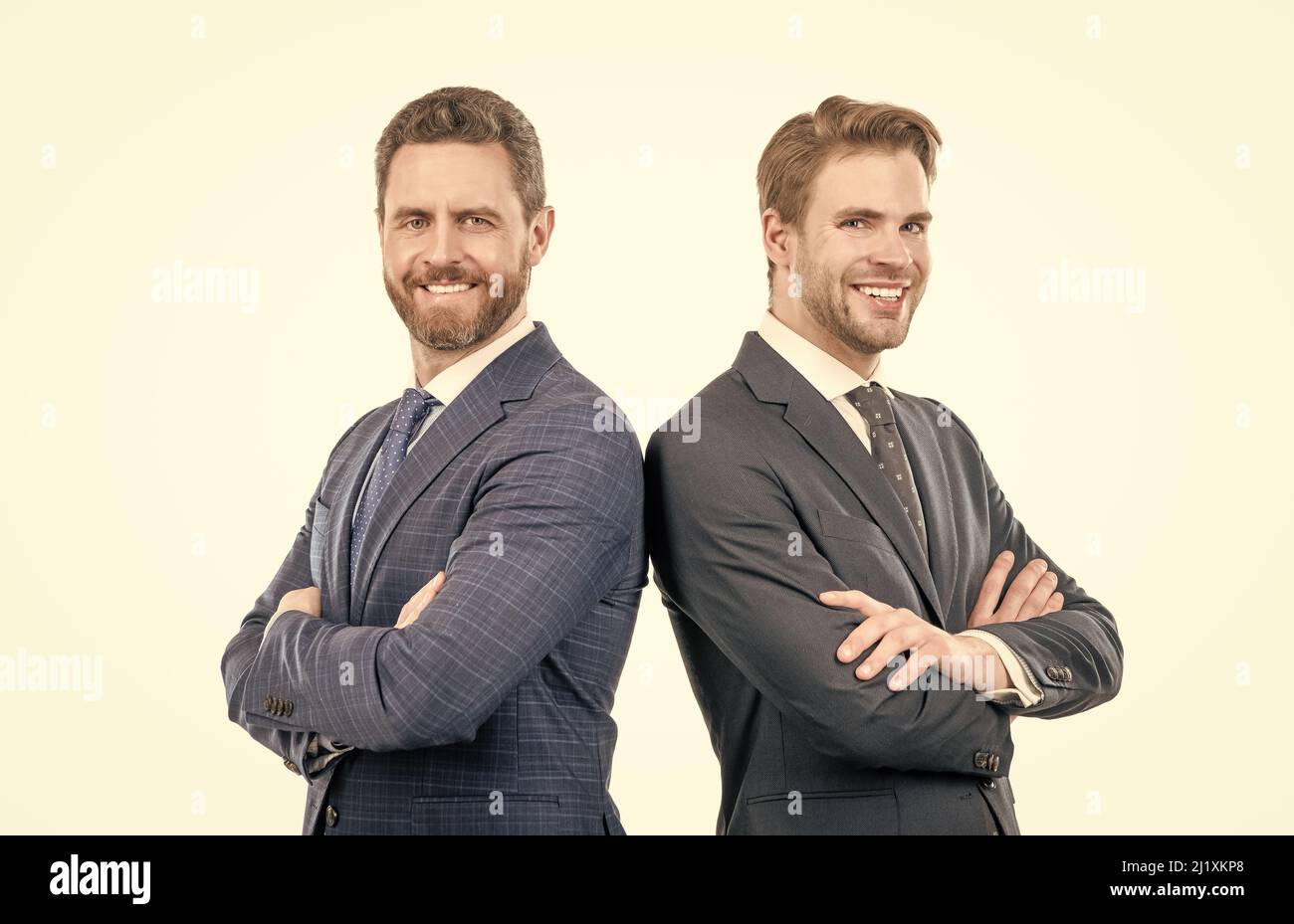 two happy business leaders in suit cross hands isolated on white ...