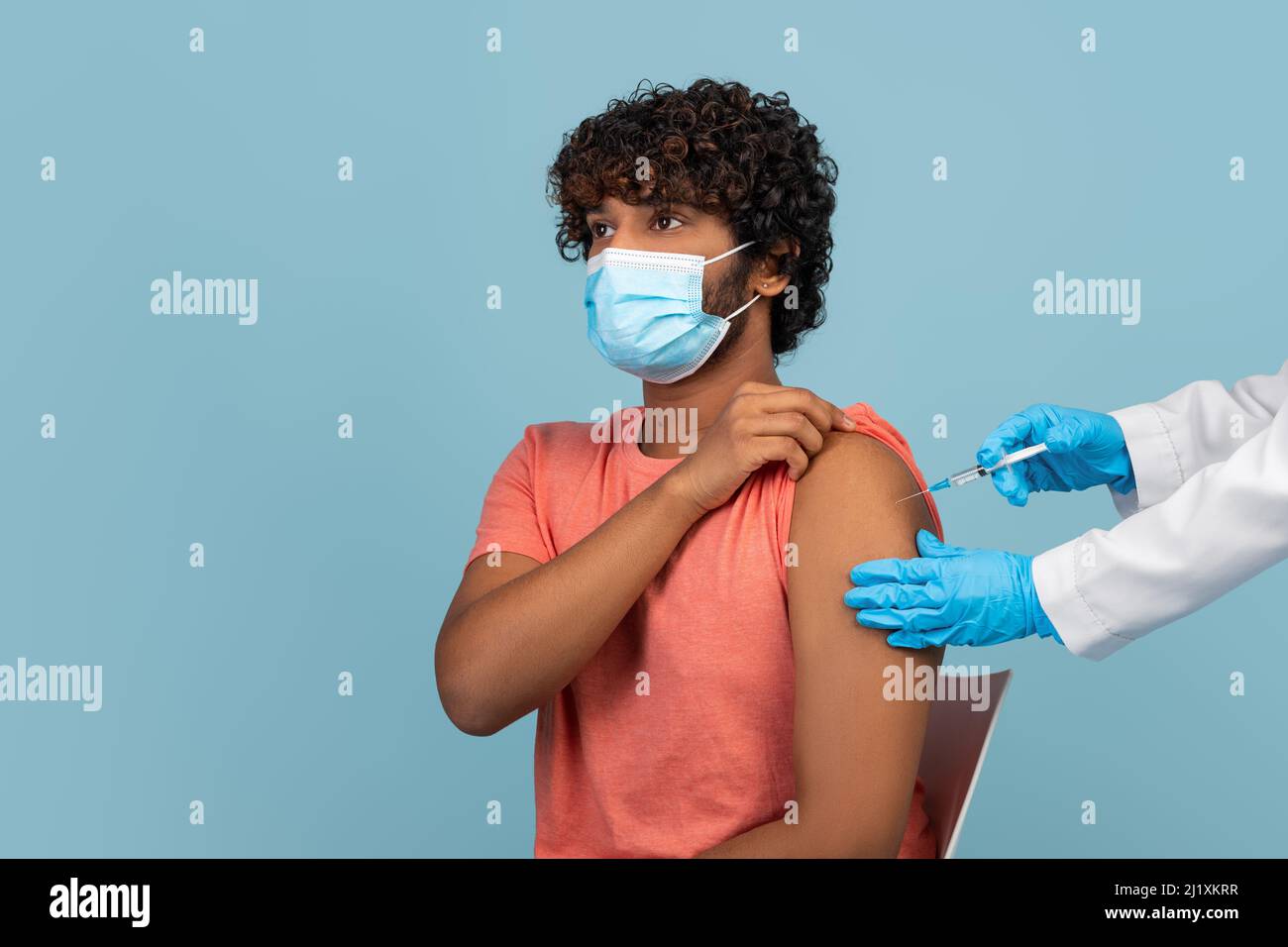 Doctor hands making intramuscular injection for indian guy Stock Photo ...