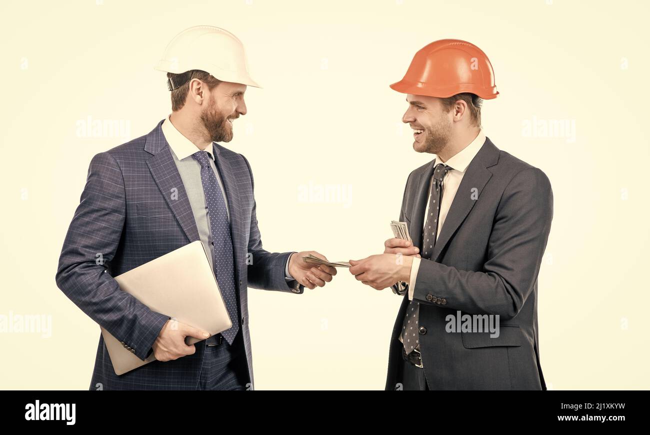 investment in architectural project. men businessmen in hardhat with ...