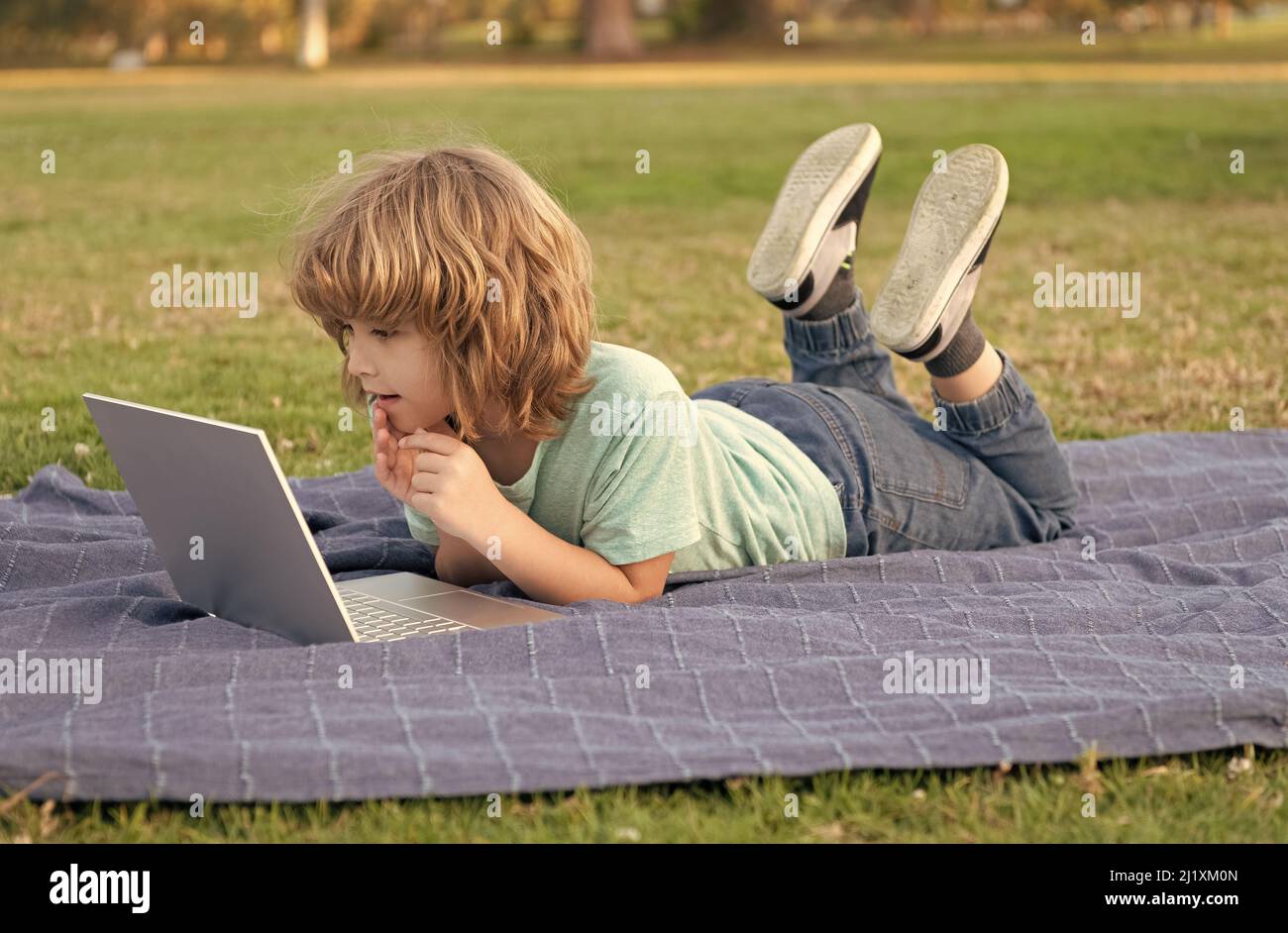 typing school blog on computer. small kid on video lesson. teen boy use ...