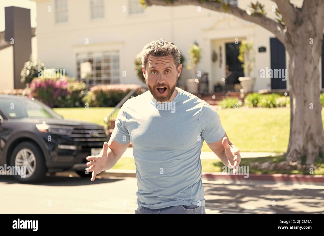 amazed unshaven guy gesturing in feeling of amazement and surprise ...