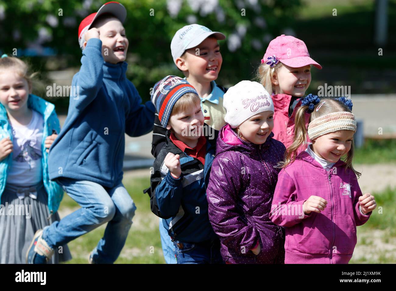 Crowd walking childhood smiling hi-res stock photography and images - Alamy