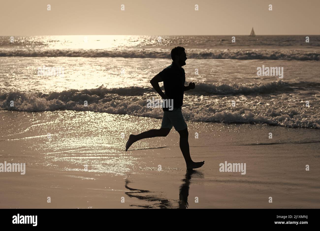 athlete run fast to win in the ocean. morning workout activity. healthy ...