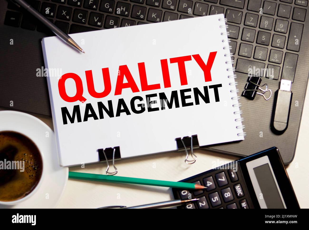 Quality management, Text message on white paper Stock Photo - Alamy