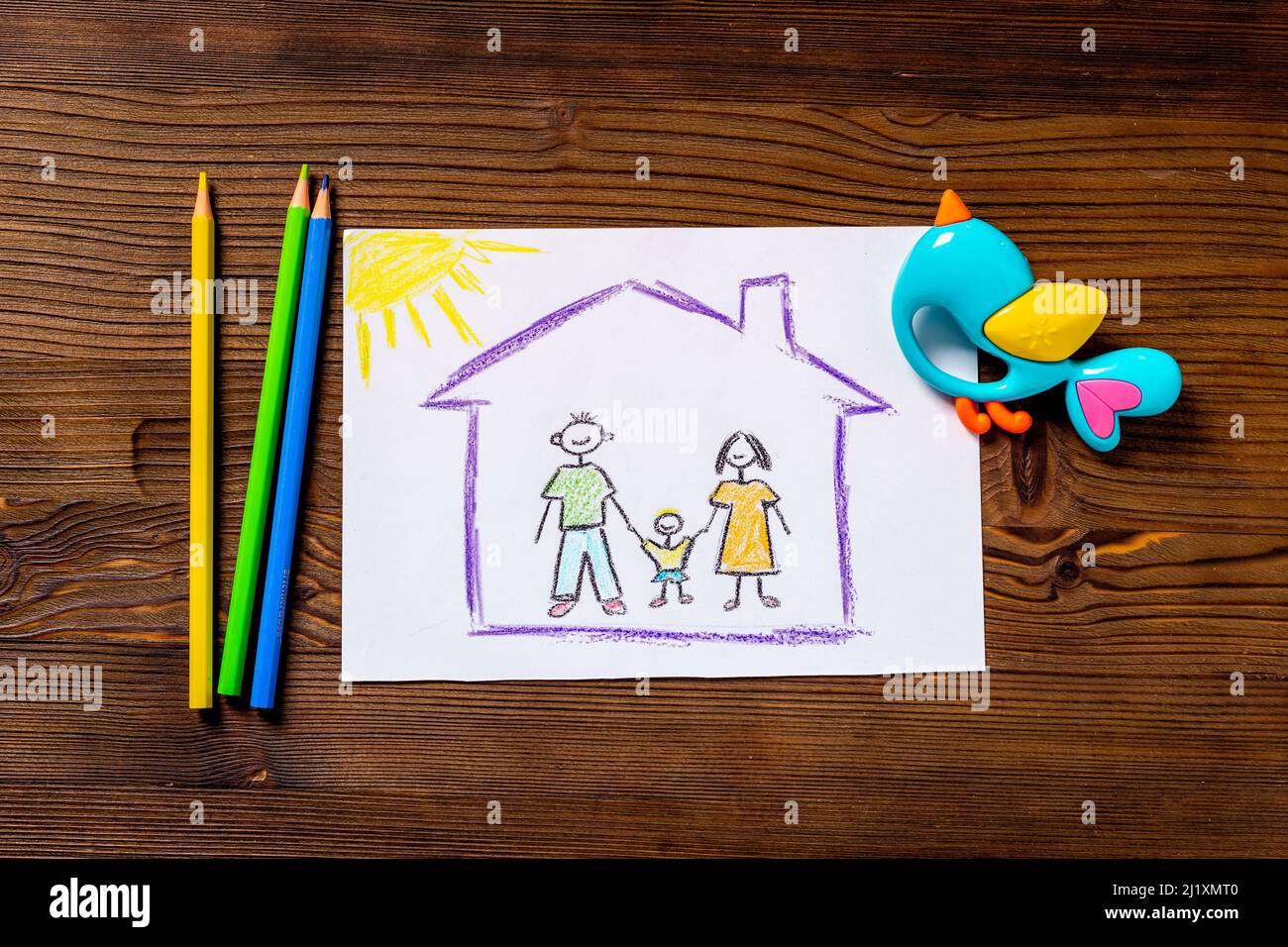 Childs drawing of happy family. Adoption concept Stock Photo - Alamy