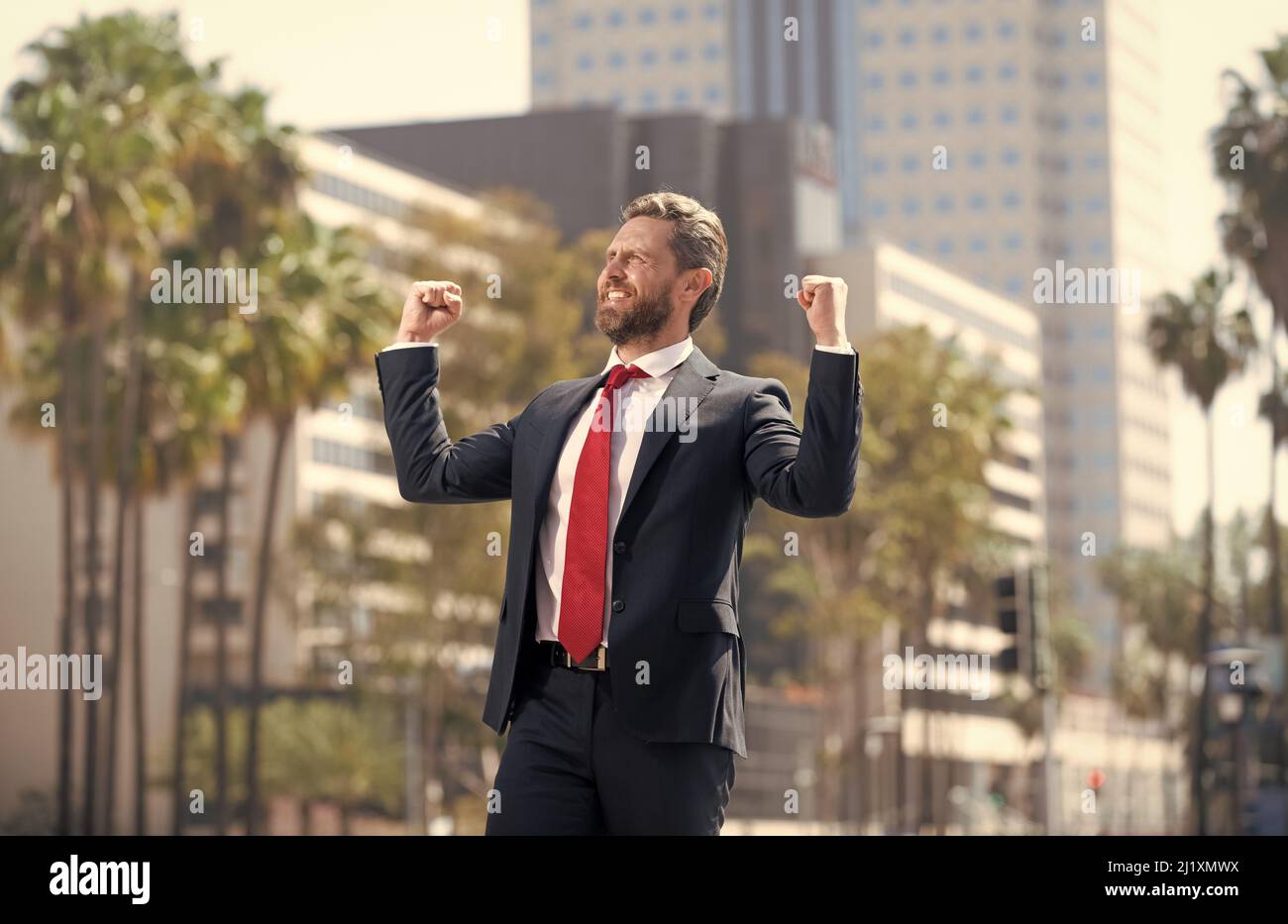 business success. successful boss in suit. excited entrepreneur ...