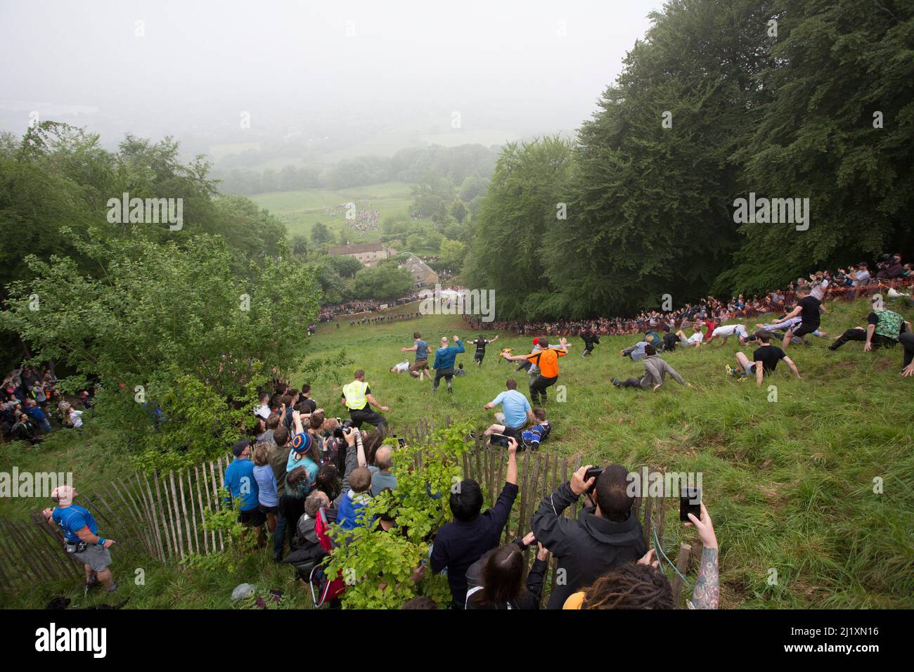 Gloucester, UK. The annual cheese rolling race held at Coopers Hill ...