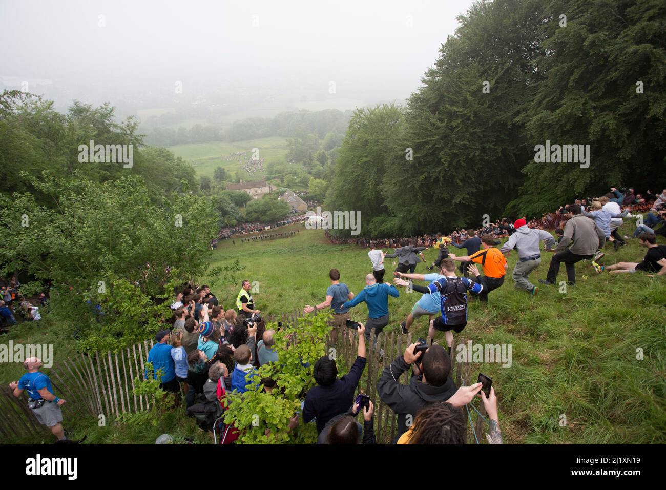 Gloucester, UK. The annual cheese rolling race held at Coopers Hill ...