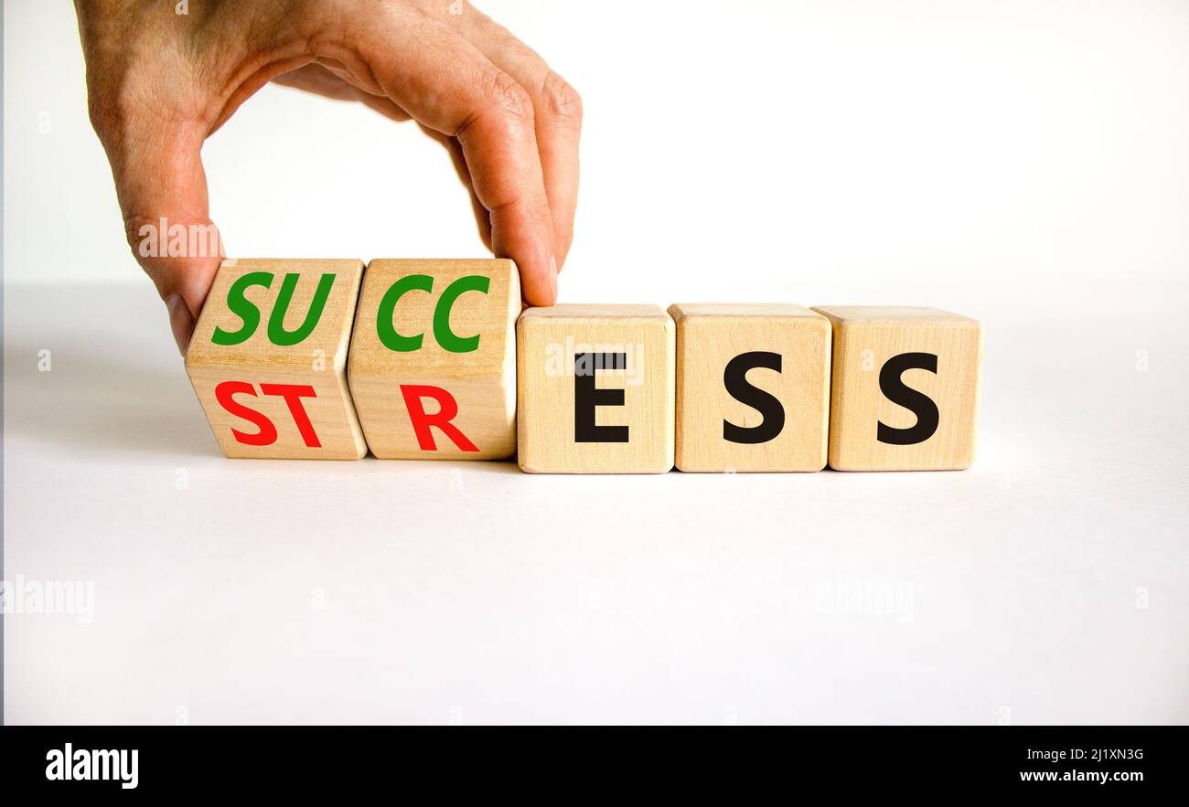 Success instead of stress symbol. Businessman turns cubes and changes ...