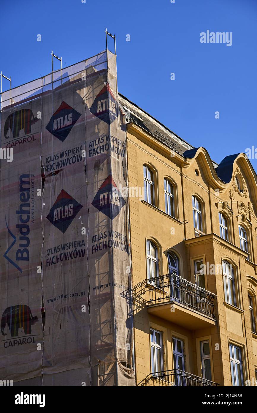 A vertical shot of the Atlas company logo on the top of an old building ...