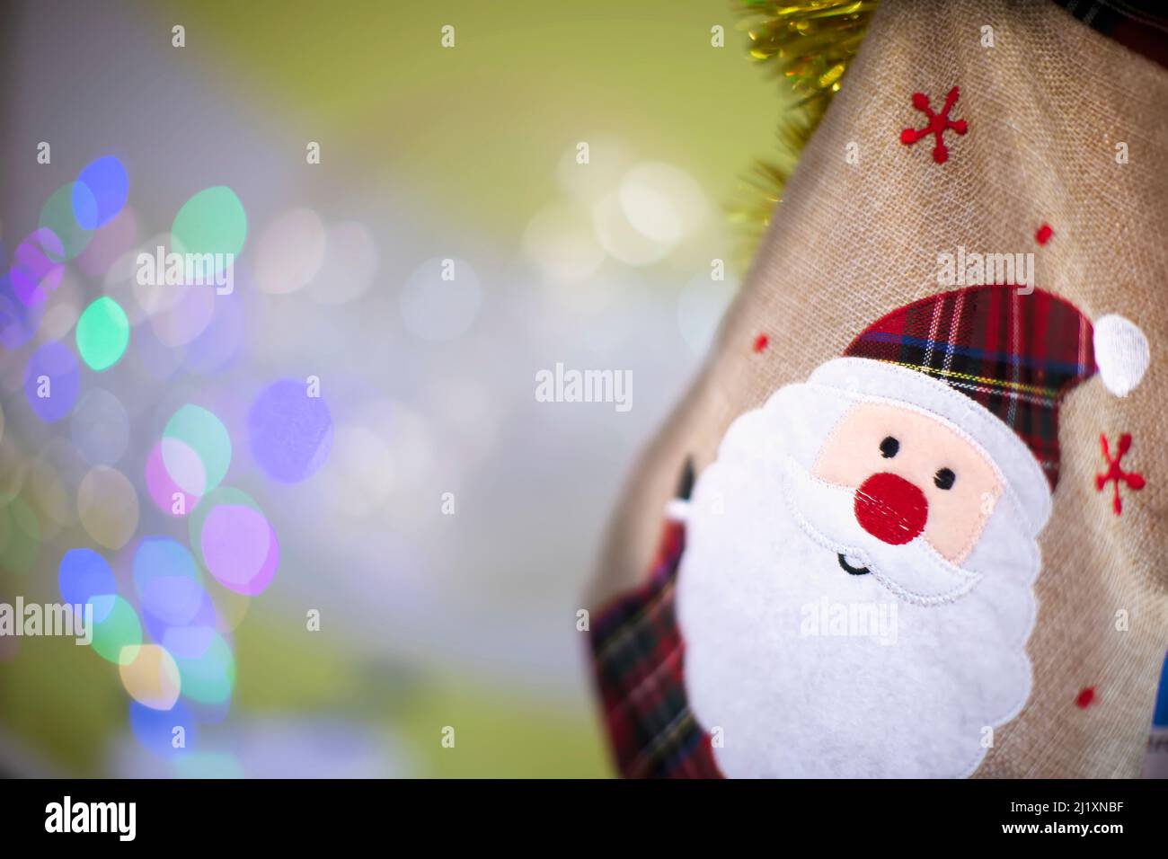 Funny santa claus made of cloth on colorful bokeh background Stock ...