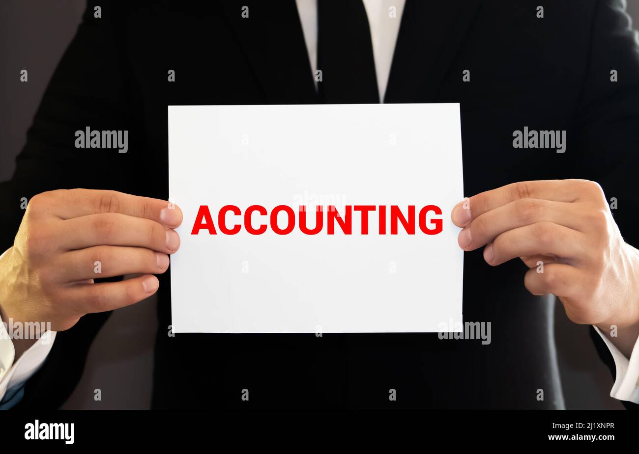 ACCOUNTING word inscription on a yellow folder with calculator and pen ...