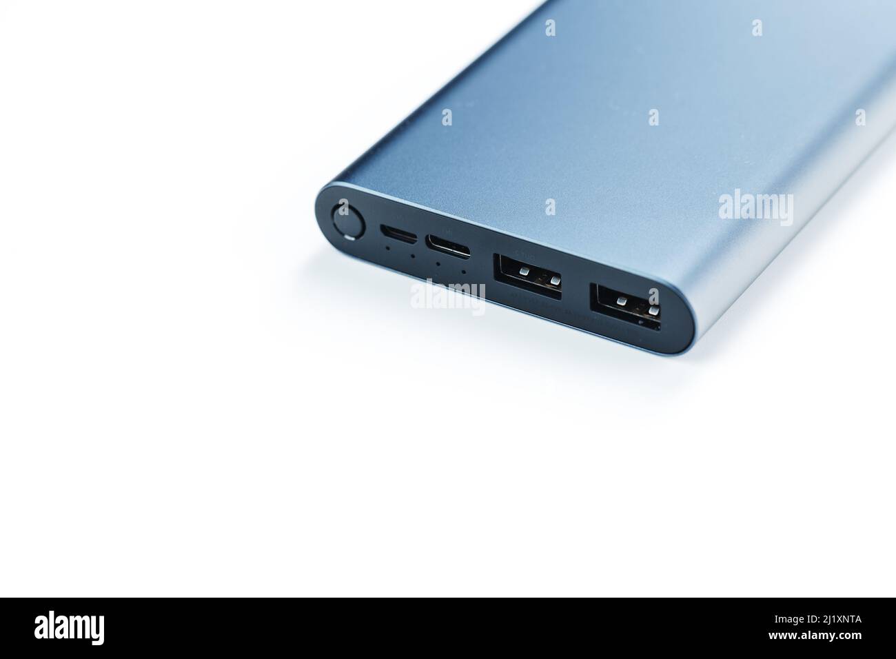 Blue Power Bank for charging mobile devices isolated on white ...