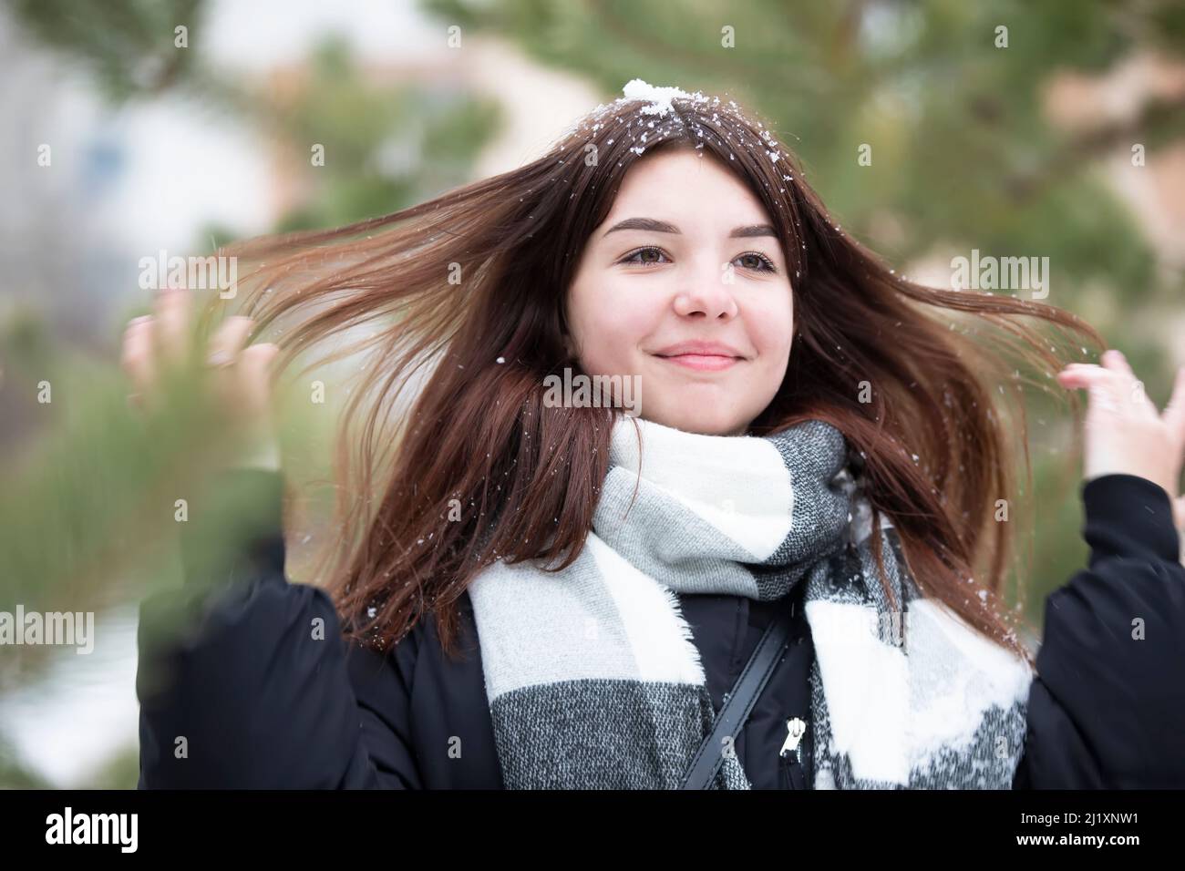 Happy teen girl with long snowy hair in winter Stock Photo - Alamy