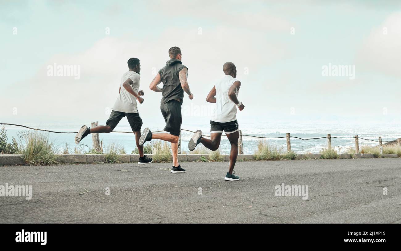 Were almost at the finish line. Shot of a group of men exercising in ...
