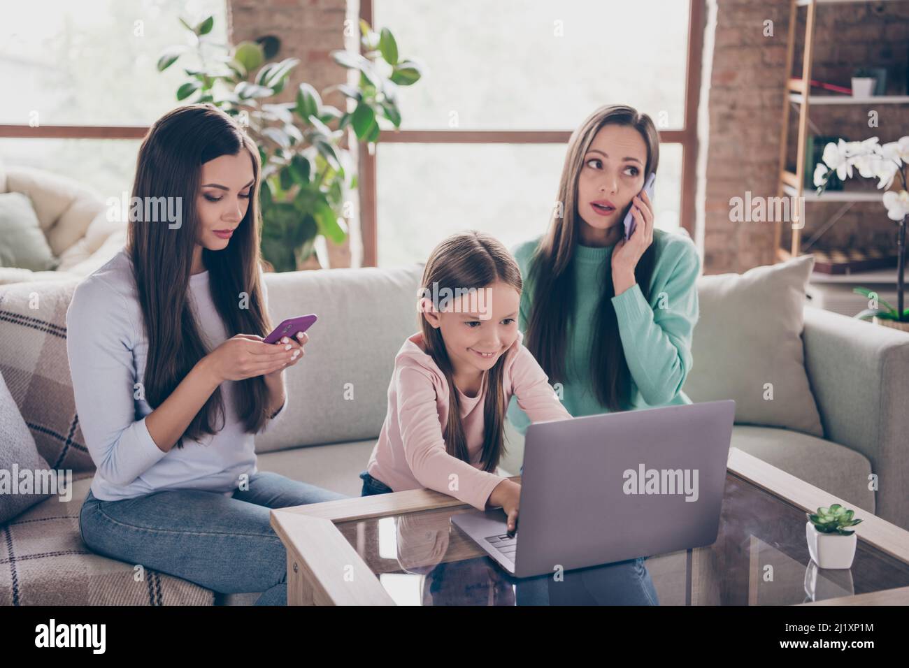Photo of three busy lovely ladies sitting divan room speak mobile ...