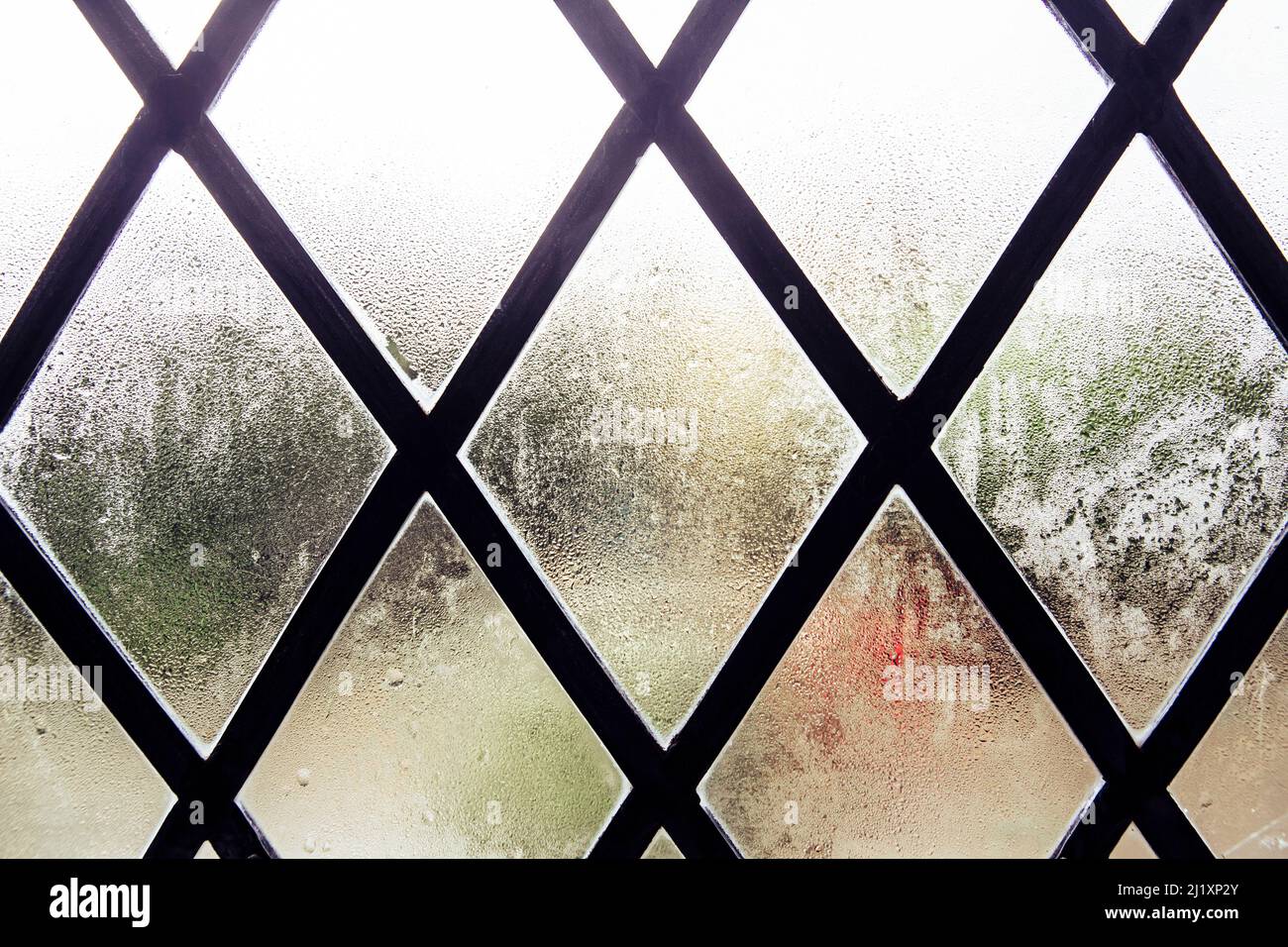 An old leaded window with condnesation on the glass pane Stock Photo ...