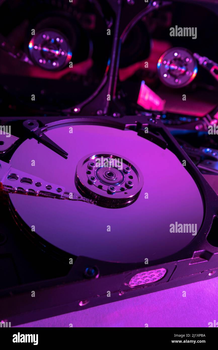 Close up of the open case of a computer hard drive showing the disc and ...